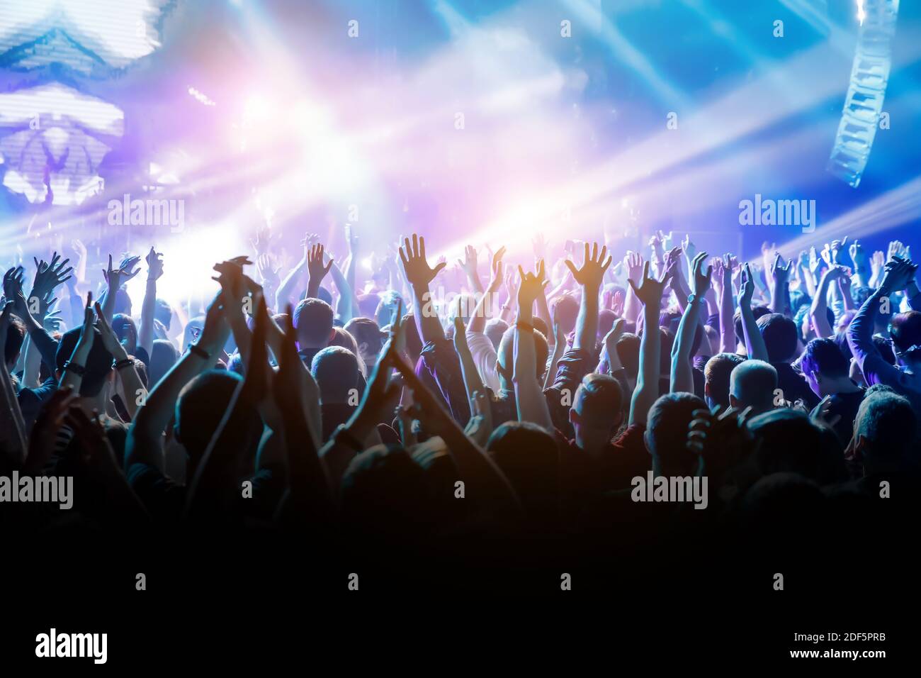 Crowd with raised hands on music concert Stock Photo - Alamy