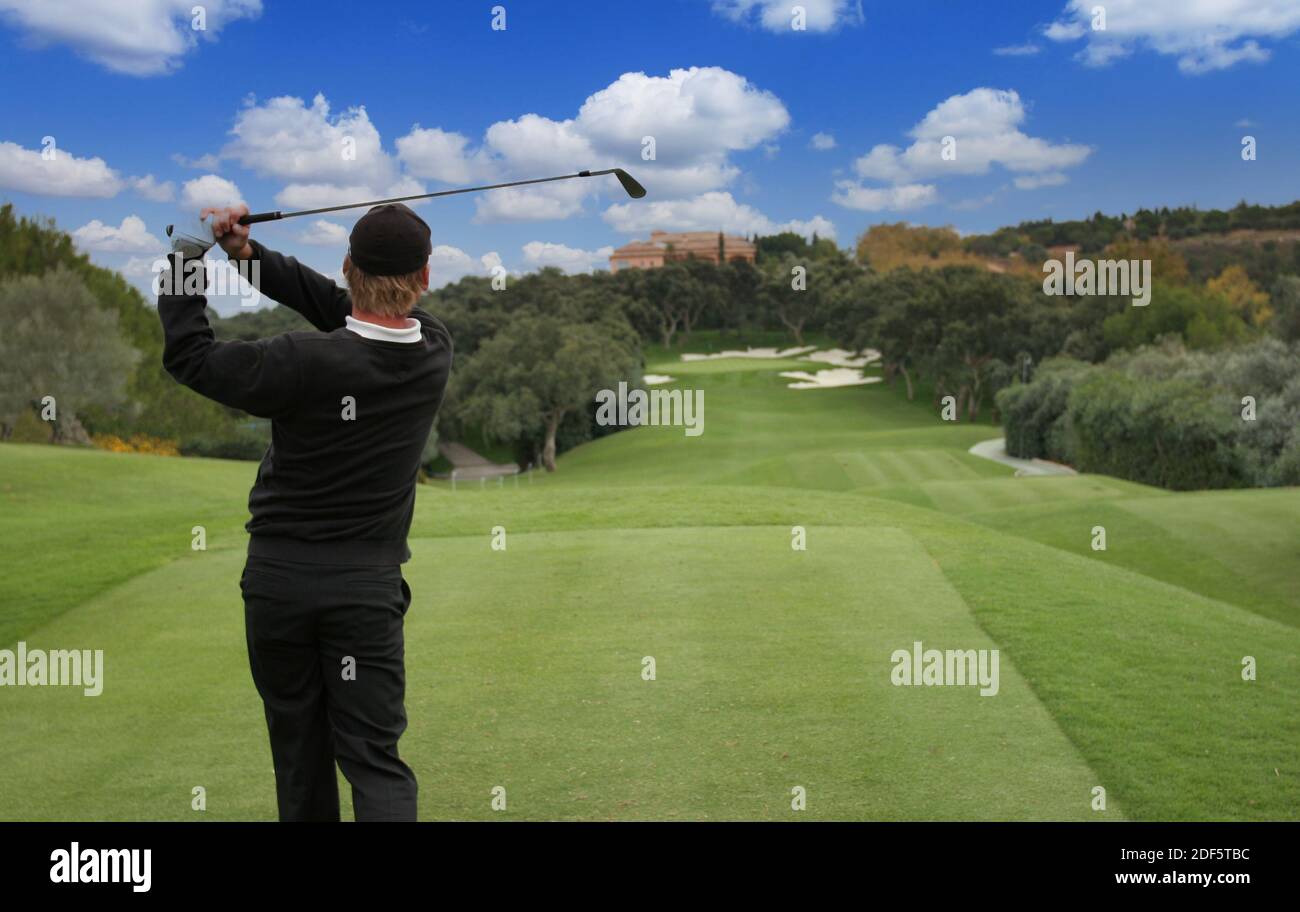 man golf swing in valderrama golf course, spain Stock Photo - Alamy