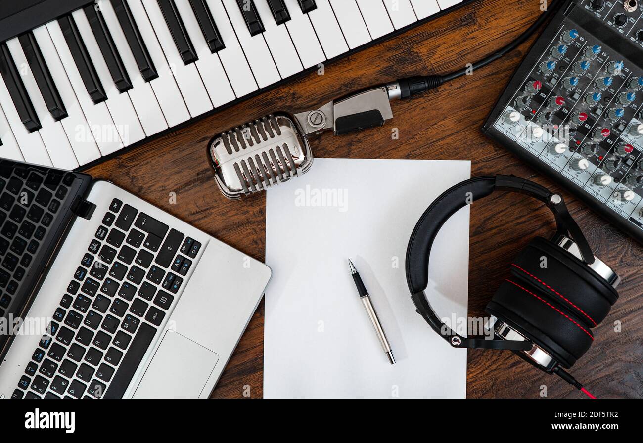 Music studio equipment and white paper with pen. Songwriting concept ...