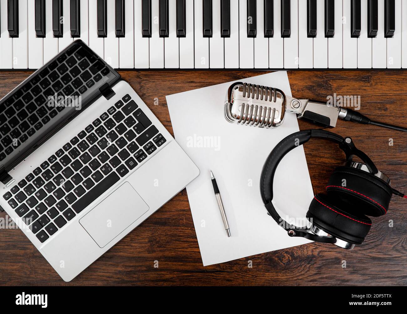 Music studio equipment and white paper with pen. Songwriting concept ...