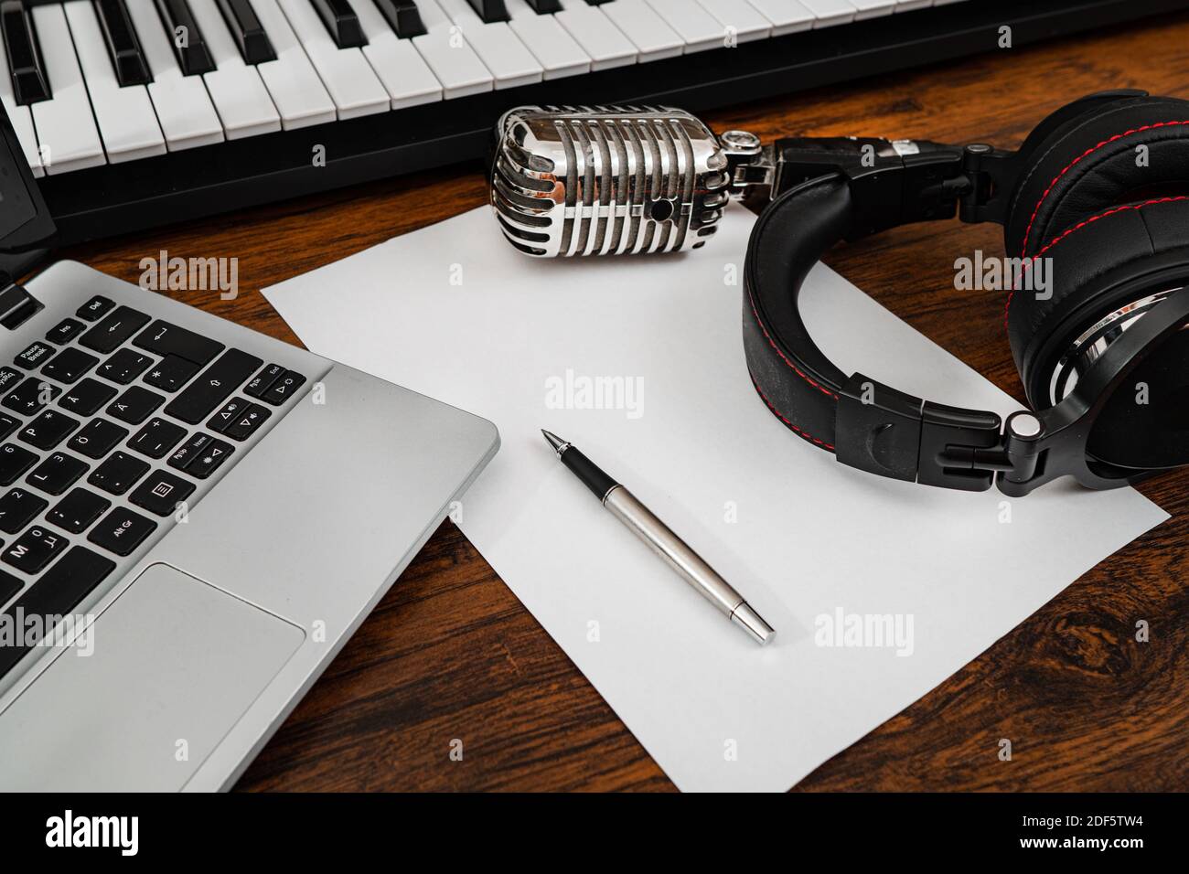Music studio equipment and white paper with pen. Songwriting concept ...