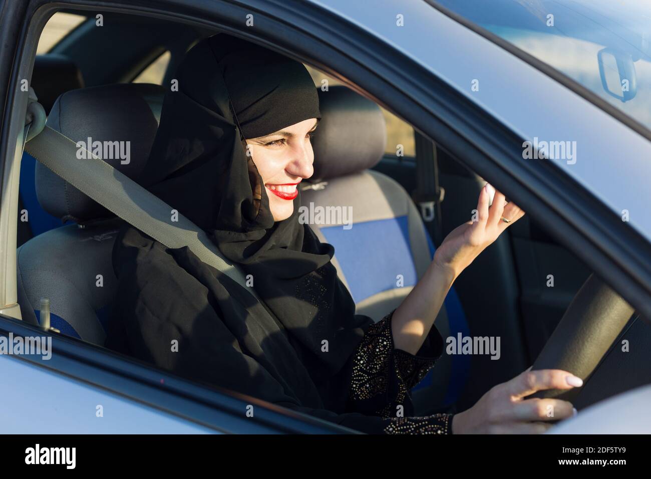 Woman car driver emotionally waving hands., Traditional clothing Stock ...