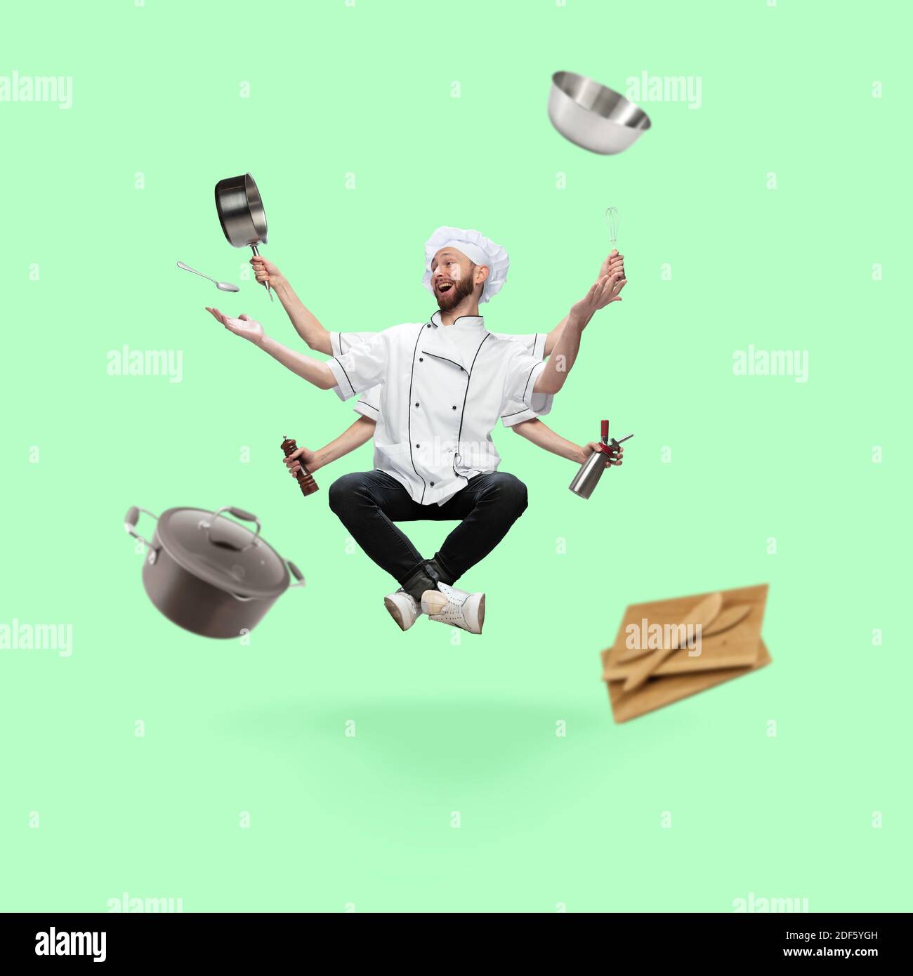 Cheerful emotional handsome cooker, chef multi-armed baker levitating ...