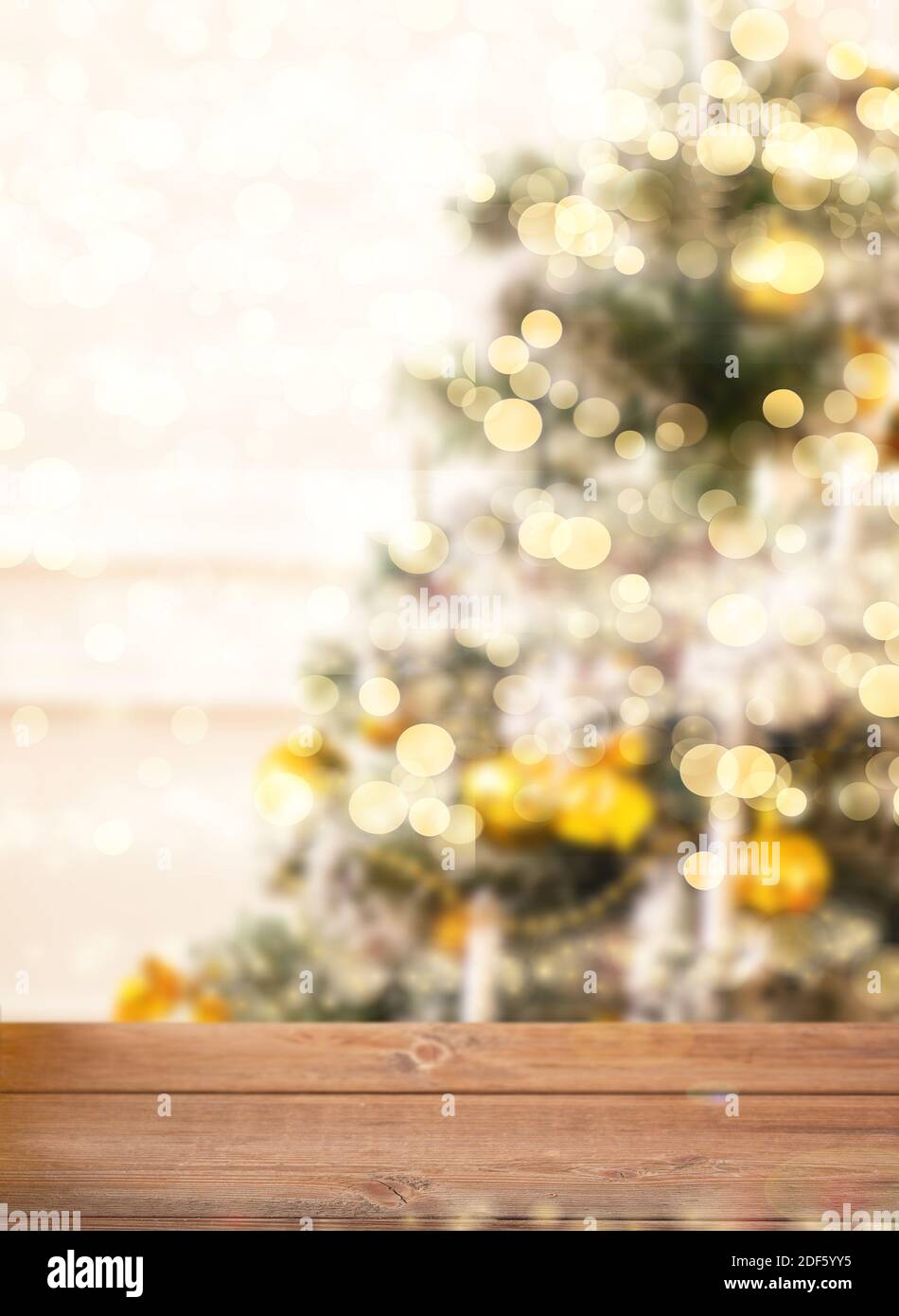 Empty wooden table top and blurred bokeh Christmas tree on the ...