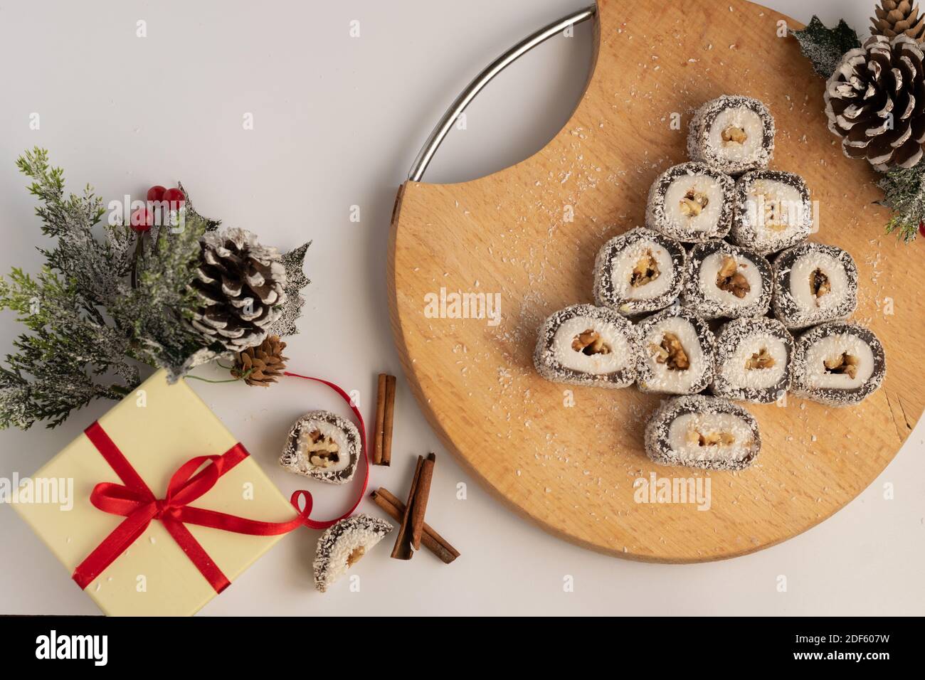 Christmas festive gift box and sweets with seasons decorations on white ...