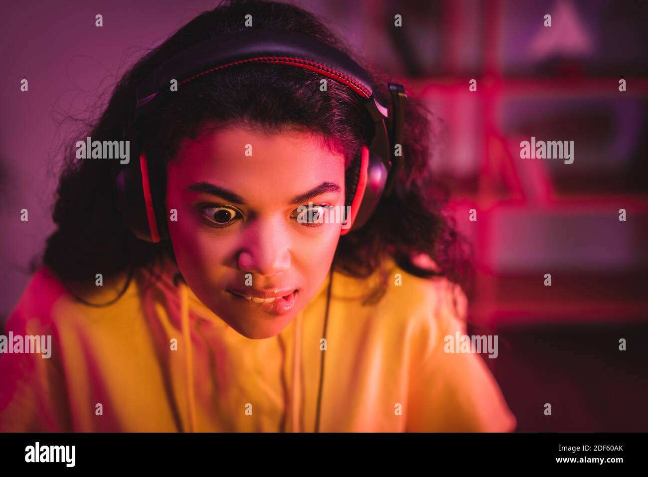 Crazy african american gamer in headset looking away at home Stock ...