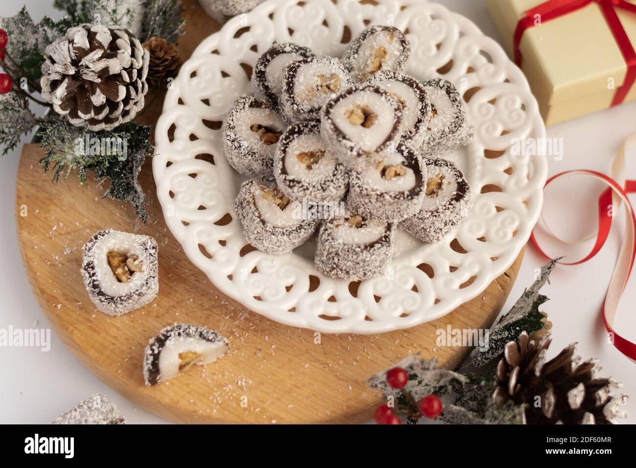 Christmas festive sweets with seasons decorations on white background ...