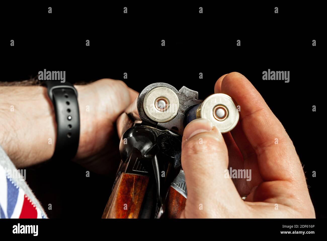 Male hands holding hunting rifle on black background Stock Photo - Alamy