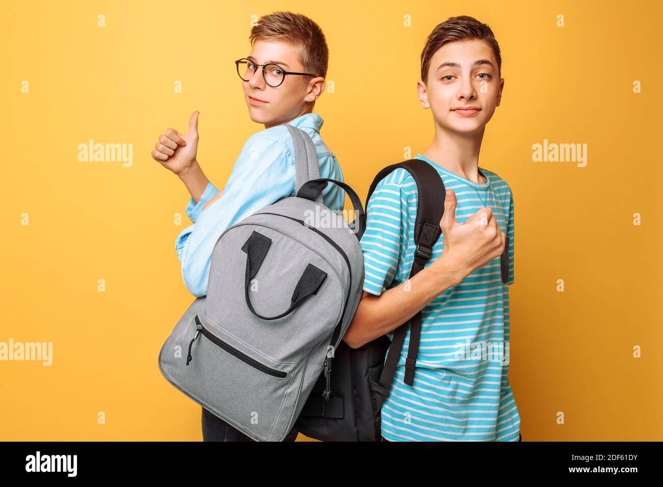 Two teenagers, guys show opposite emotions, friends show positive and ...
