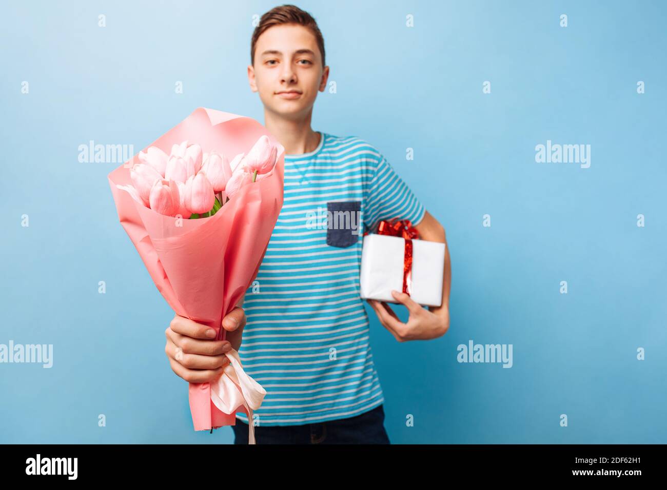 Boy holding bunch of roses hi-res stock photography and images - Alamy