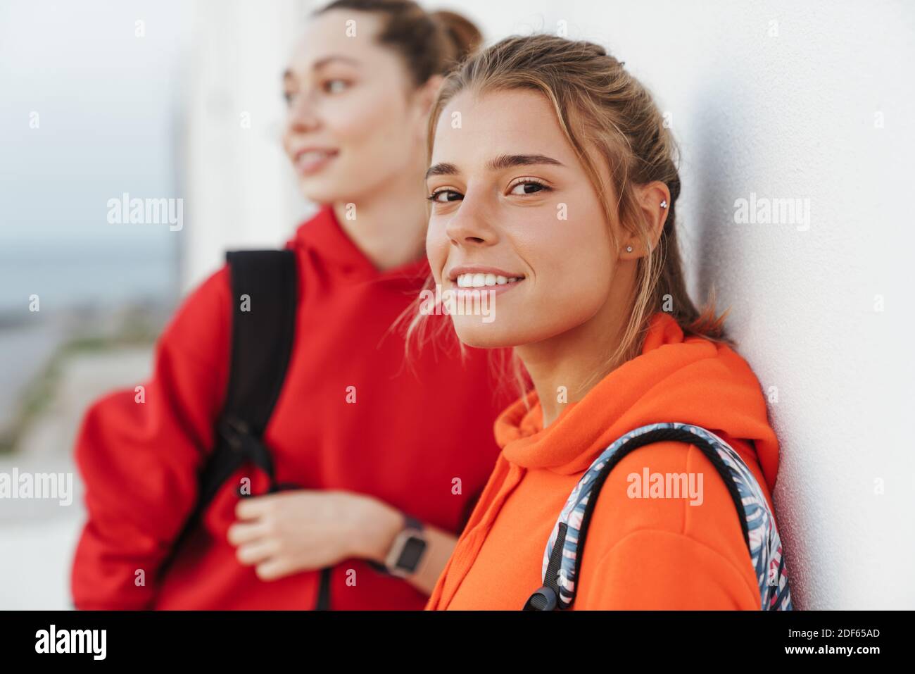 Image of a young positive optimistic beautiful girls friends walking ...