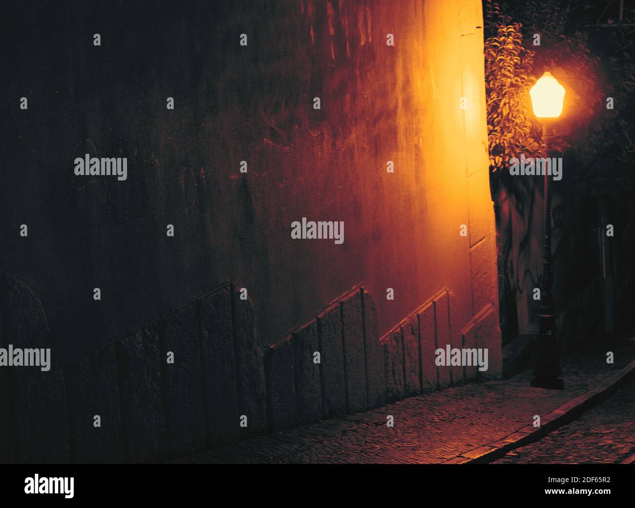 Old wall lit by old-fashioned street light Stock Photo - Alamy