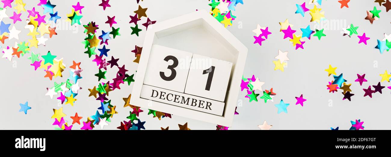 31 December calendar and colorful confetti on white. Happy new year ...