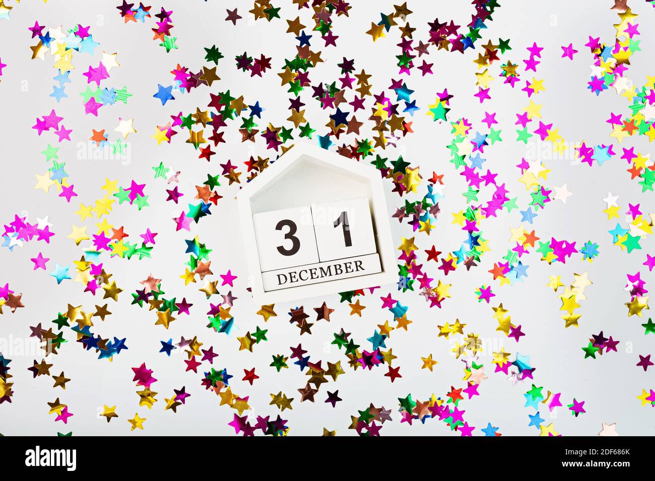 31 December calendar and colorful confetti on white. Happy new year ...