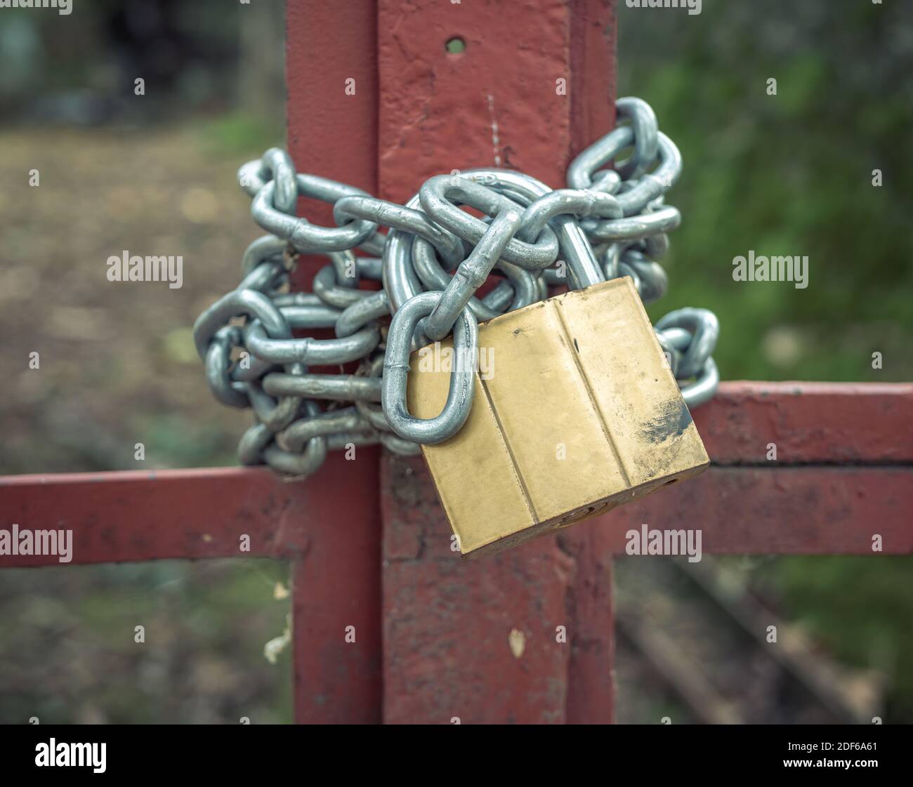 Steel chain and a lock or padlock on a metal gate or door Stock Photo ...
