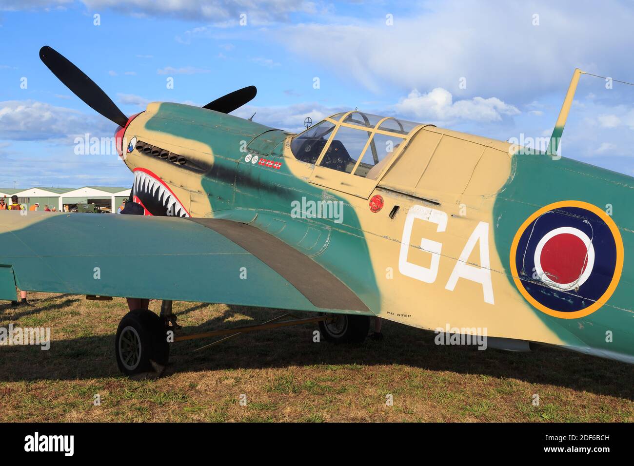 A World War Two era P-40 Kittyhawk fighter with desert camouflage, an ...