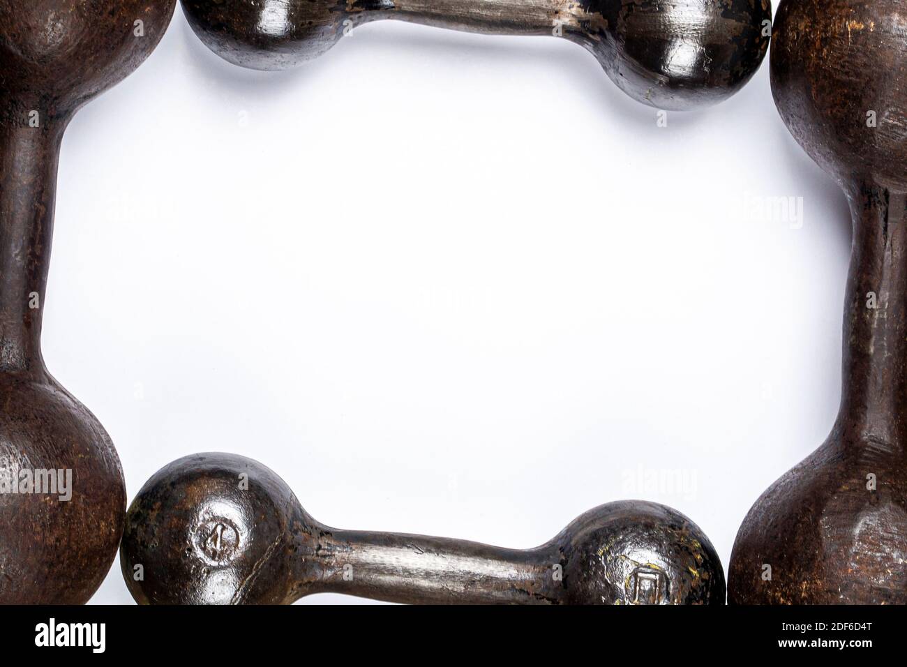 Old rusty dumbbells on white background.With copy space.Frame. Gym ...