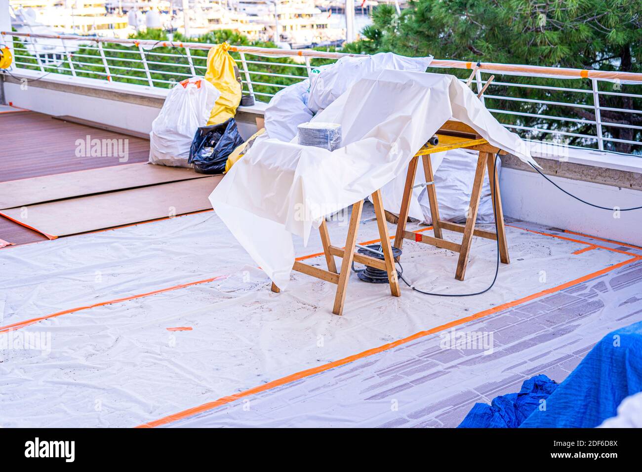Construction of a wooden terrace on a balcony. A new wooden, timber ...
