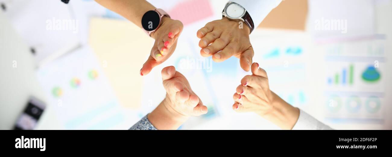 Business people over the work table are greeting hands Stock Photo - Alamy
