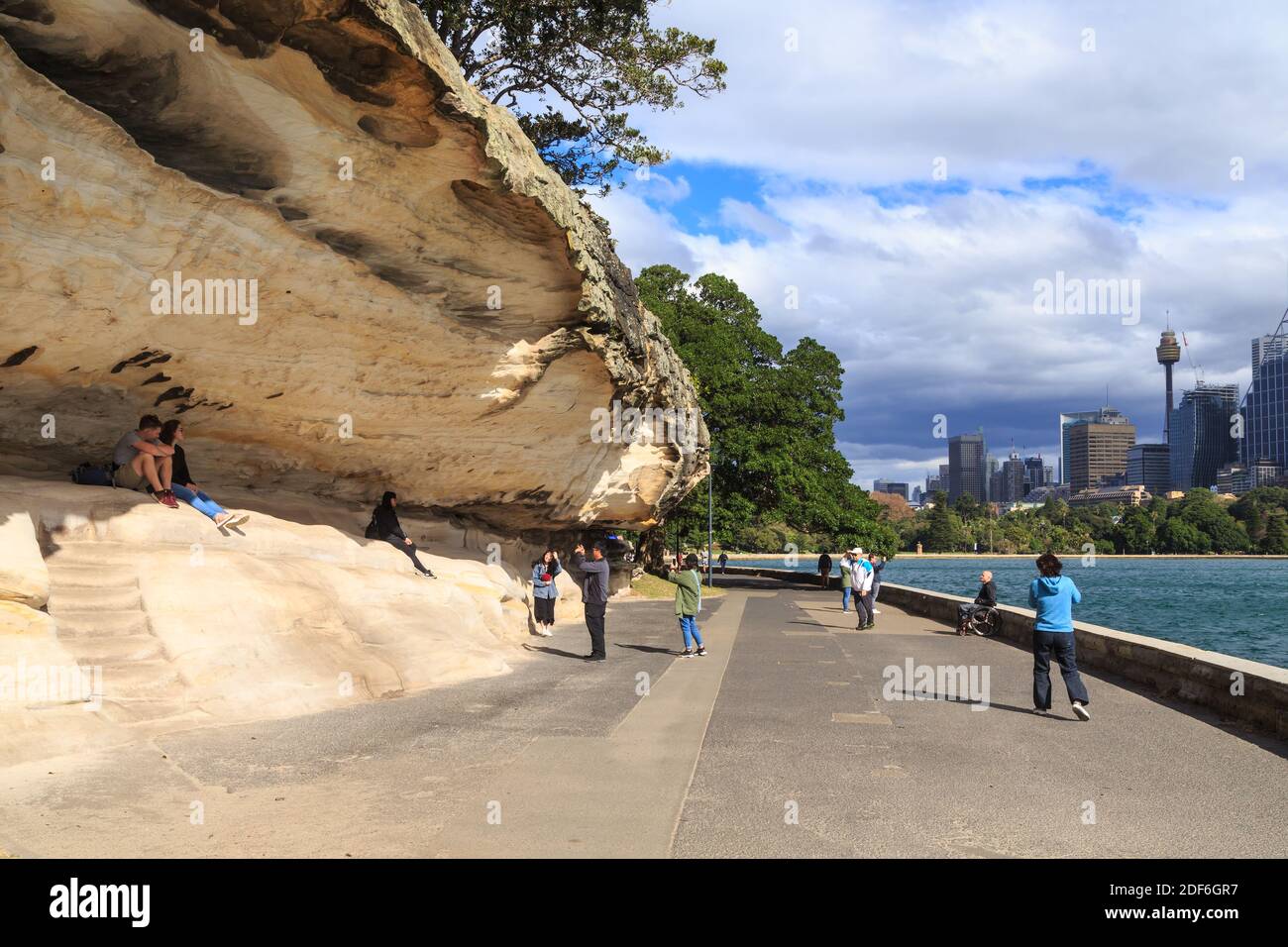 Mrs Macquaries Point, Sydney, Australia. Tourists sit in the shade of a ...