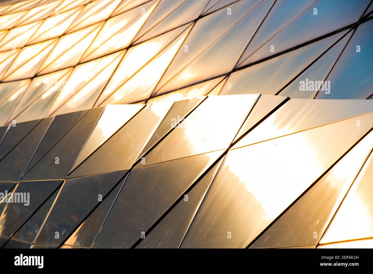 Metal and glass background, building exterior texture at sunset ...