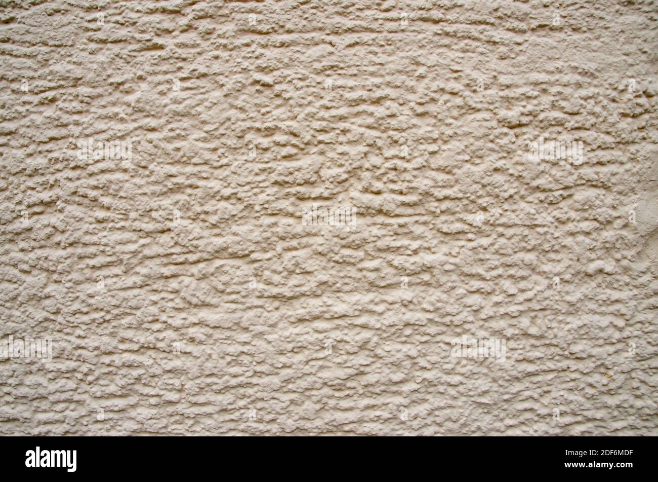 rough plaster facade painted yellow as a texture or background Stock ...