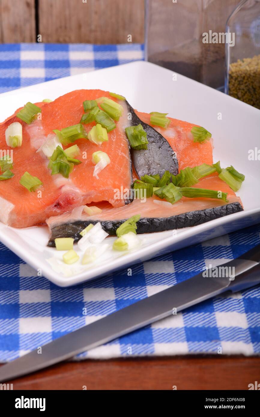 Food concept: red salmon fish, red hot chilli pepper spice with greens ...