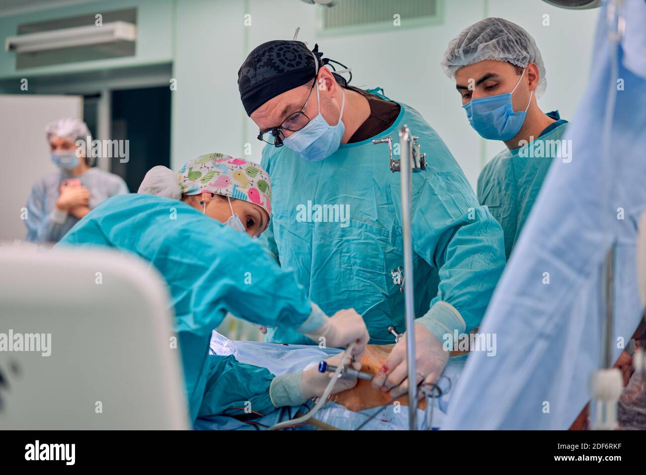 Surgeon Inserting Tube Into Patient During Surgery Stock Photo - Alamy
