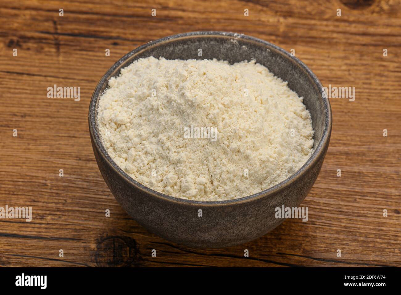 Wheat flour heap in the bowl for cooking Stock Photo - Alamy
