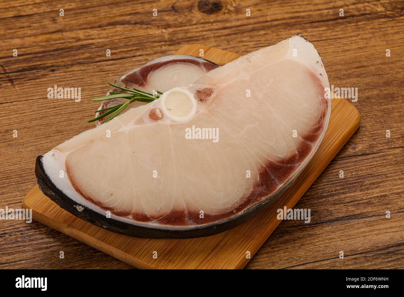 Raw shark steak served rosemary for cooking Stock Photo - Alamy