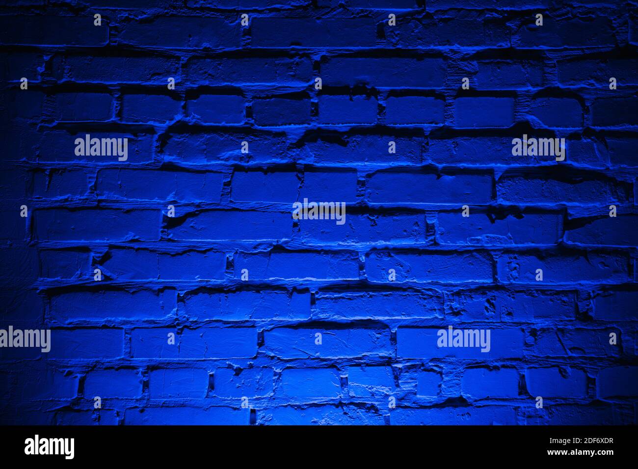 Empty brick wall with bright blue neon light background Stock Photo - Alamy