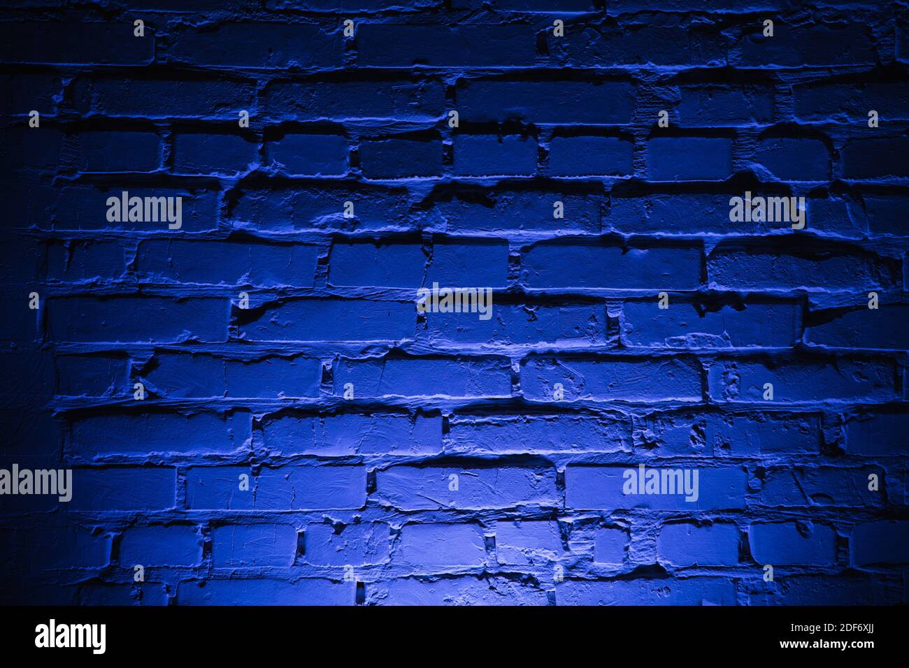 Empty brick wall with bright blue neon light background Stock Photo - Alamy