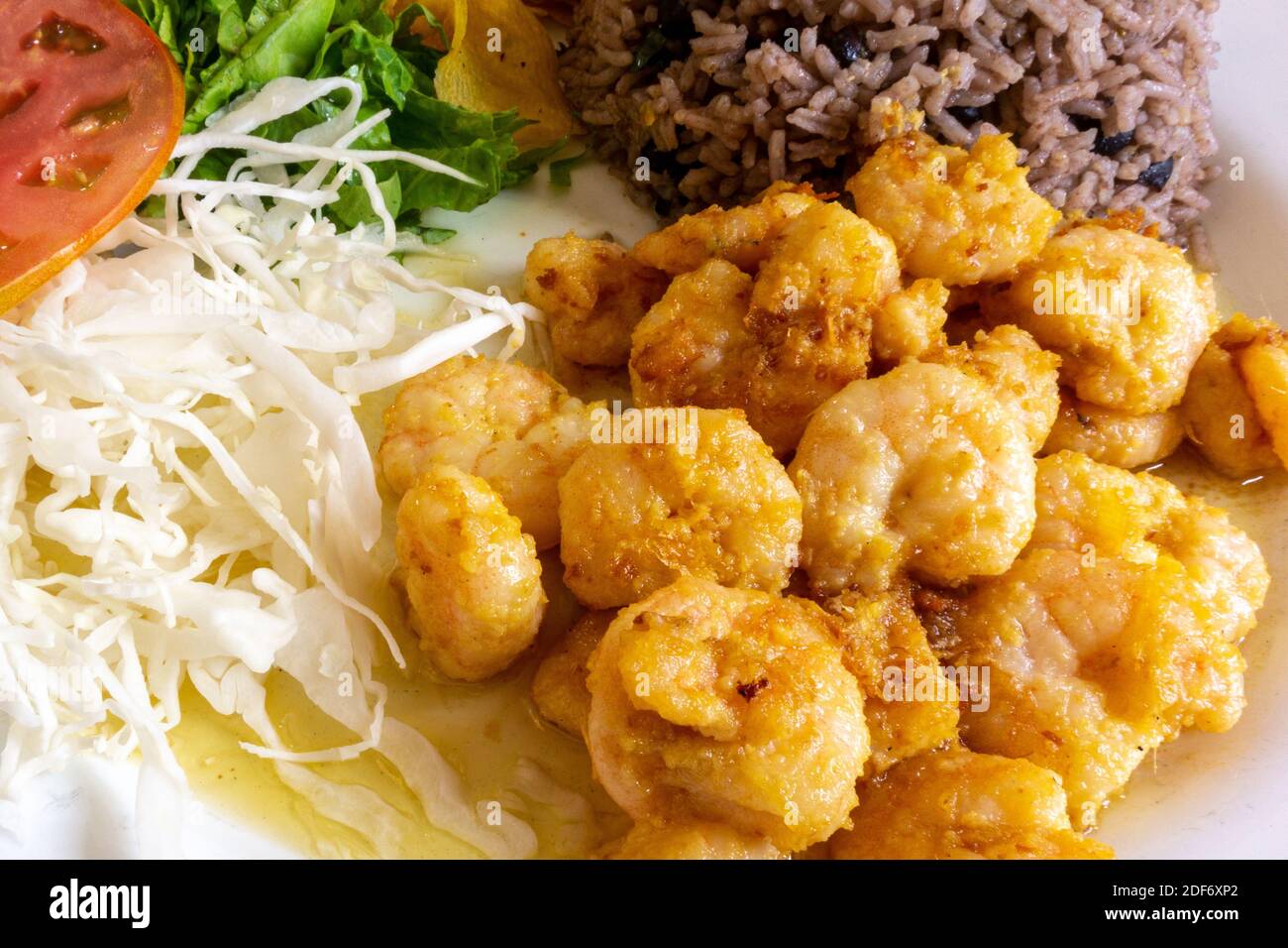 Cuban cuisine, cooked shrimp with congri rice and salad Stock Photo - Alamy