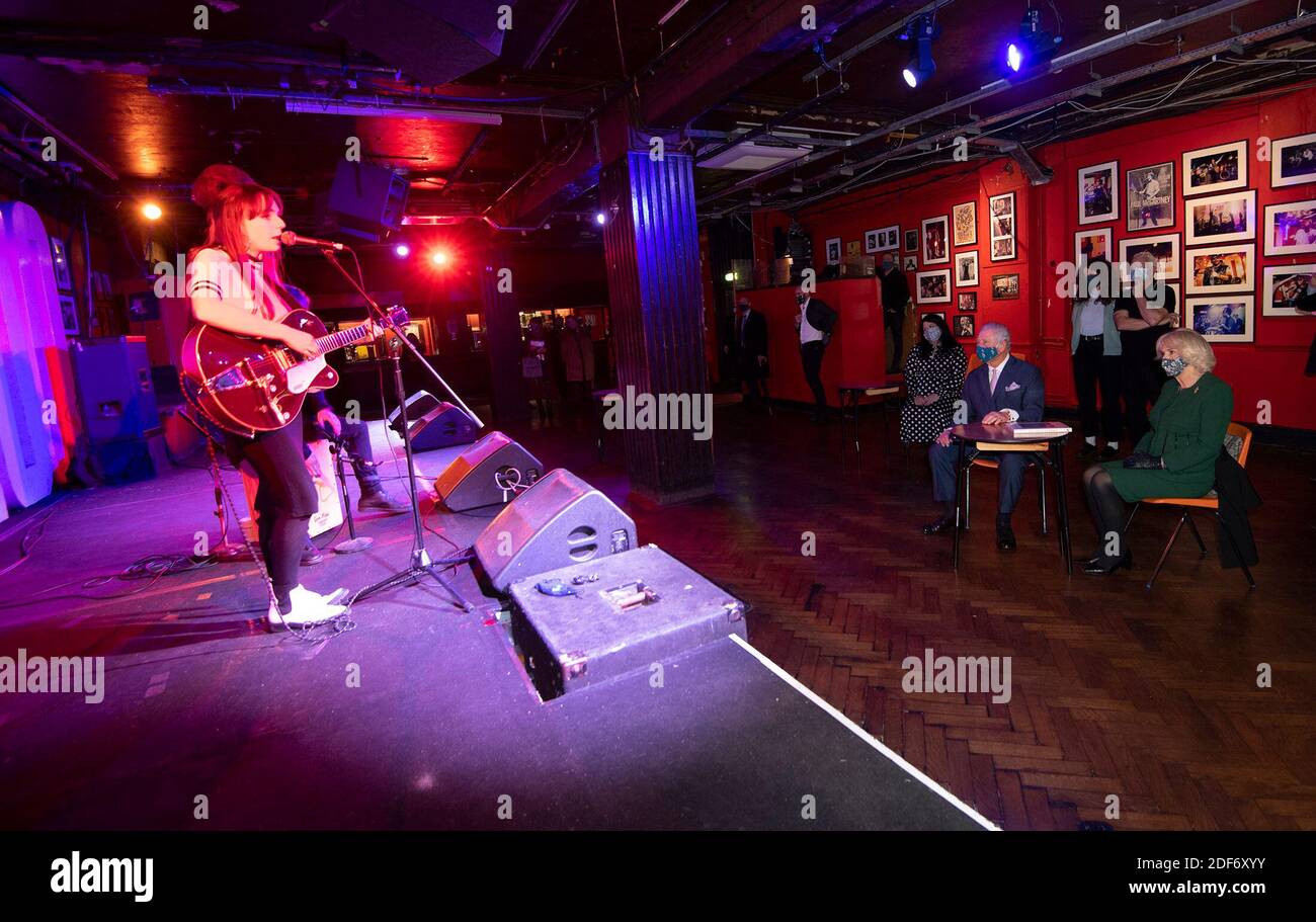 The Prince of Wales and Duchess of Cornwall watching a short musical ...