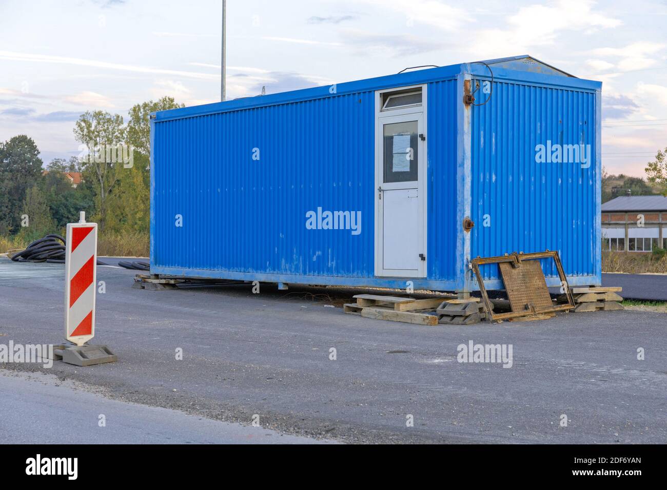 Blue Shipping Container Office at Construction Site Stock Photo - Alamy