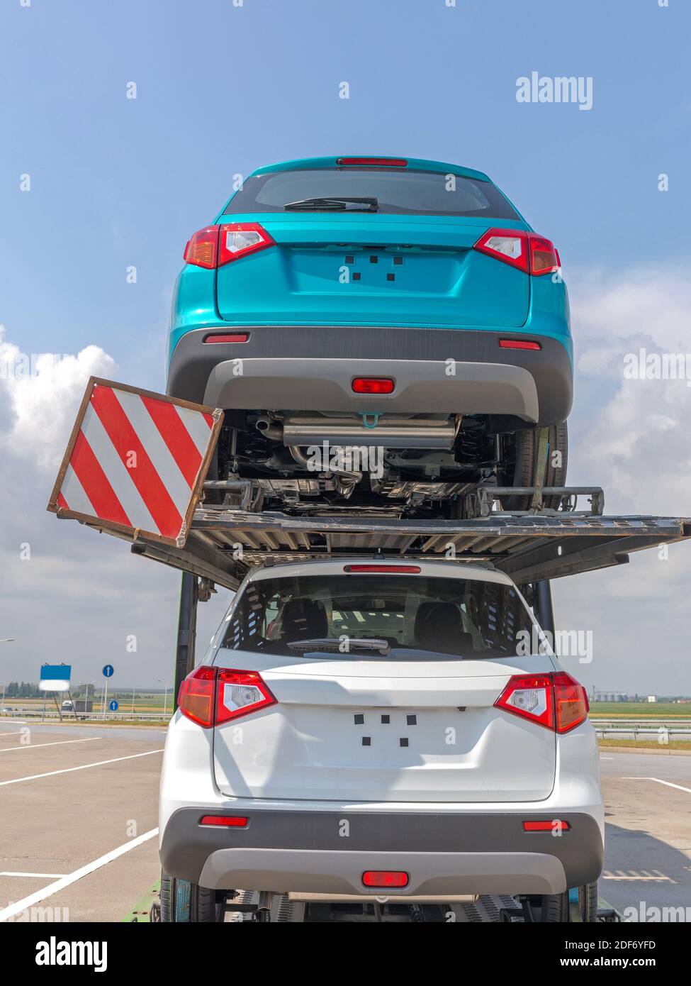 New Car Delivery Transport at Truck Trailer Stock Photo - Alamy