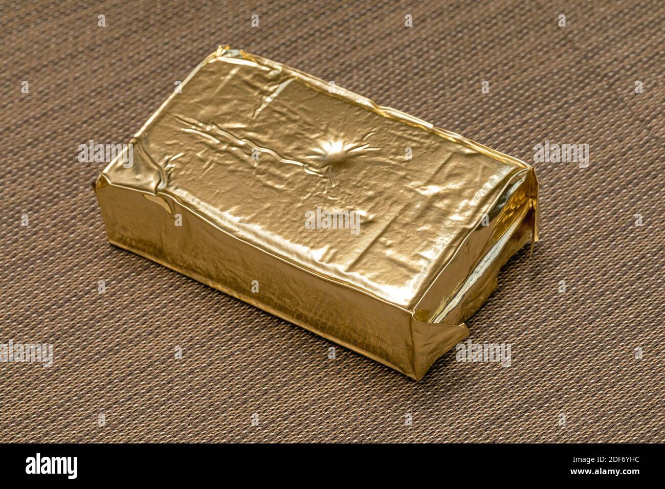 Ground Coffee Vacuum Packaging in Golden Foil Stock Photo - Alamy