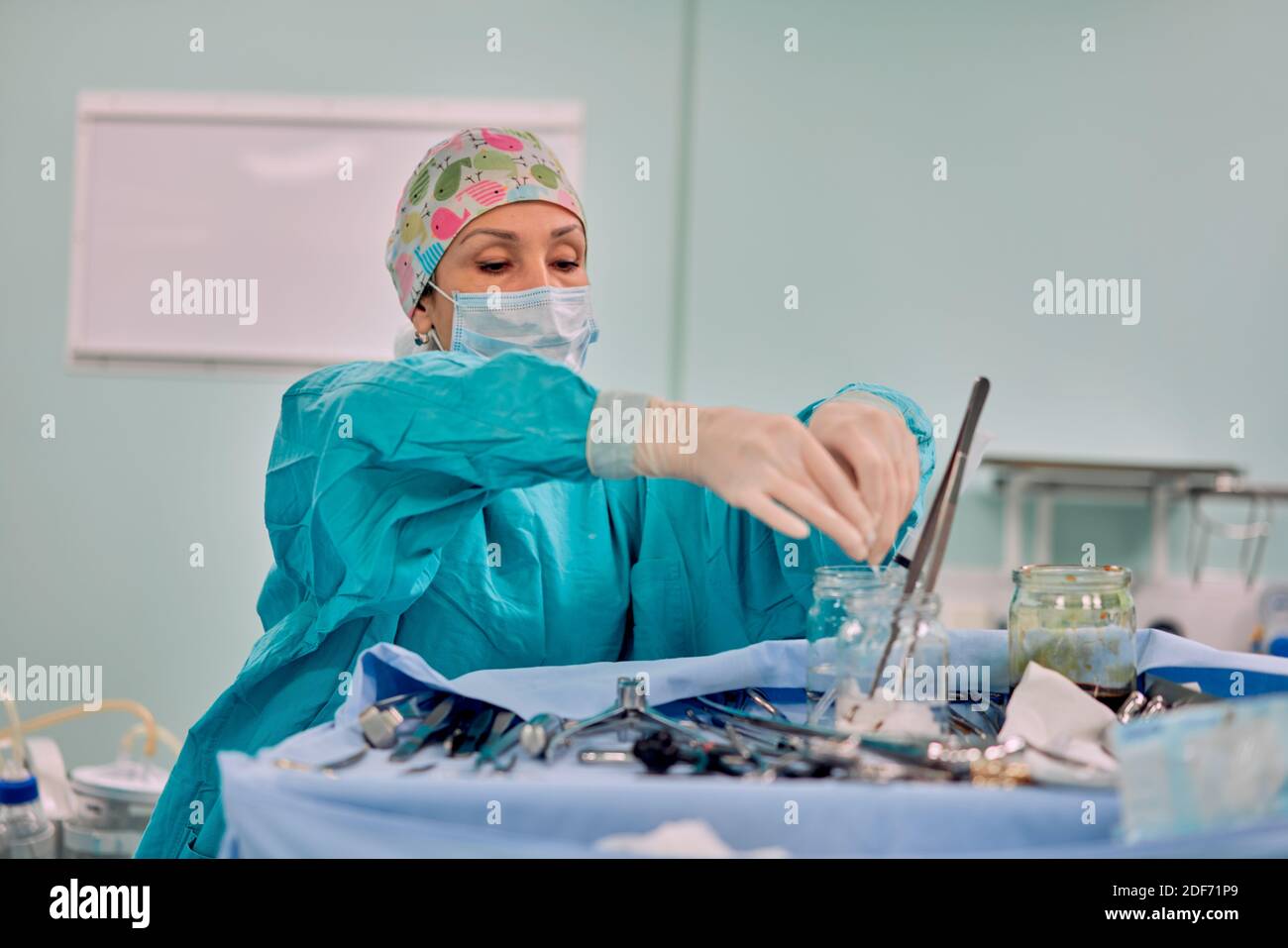 Surgeon Inserting Tube Into Patient During Surgery Stock Photo - Alamy