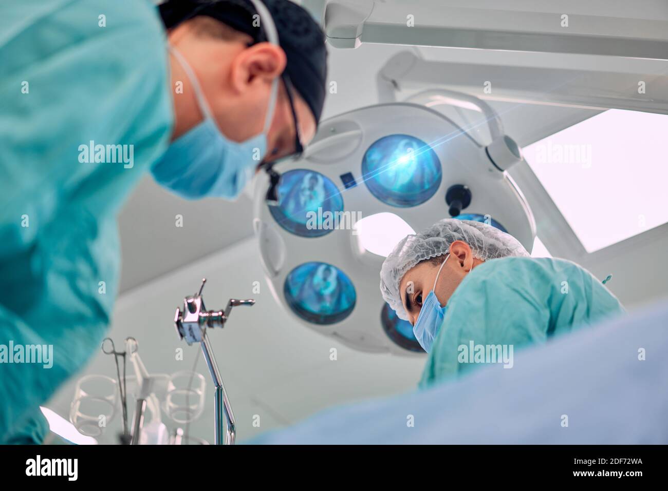 Surgeon Inserting Tube Into Patient During Surgery Stock Photo - Alamy