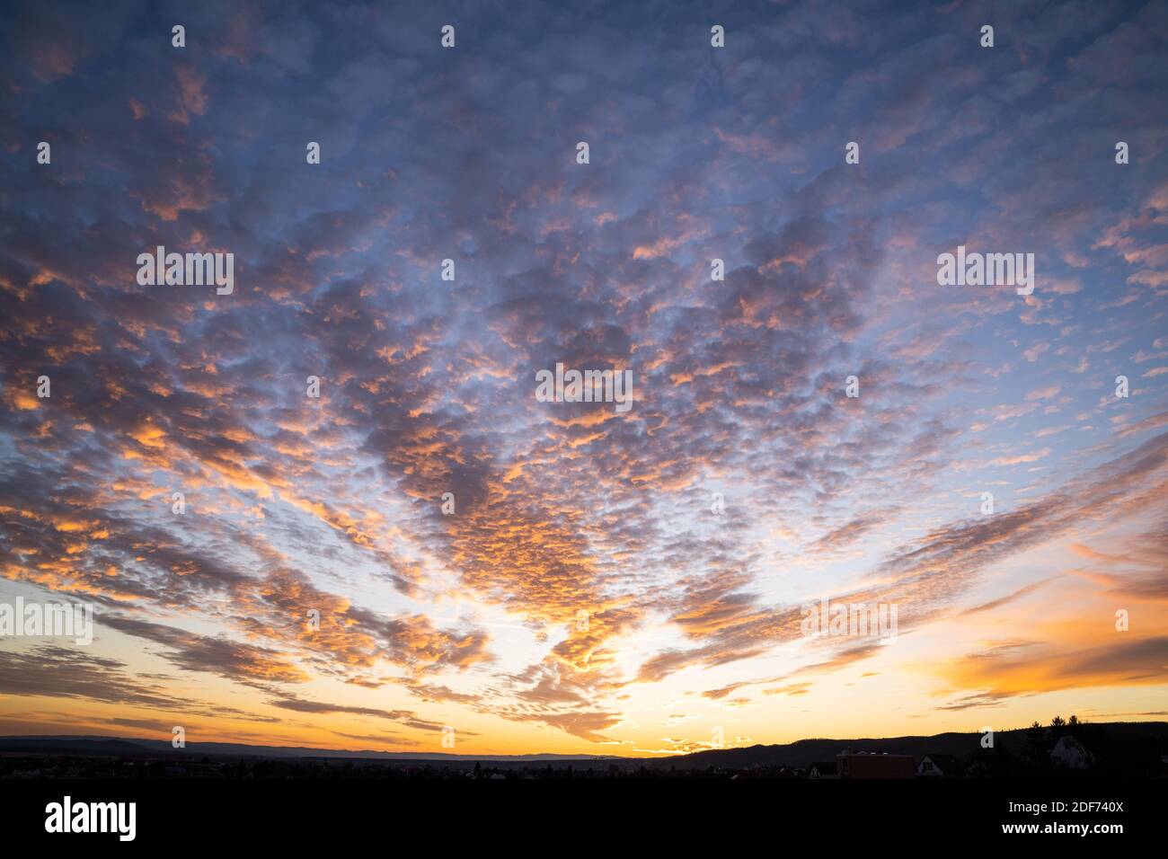 Sky at sunset with glowing clouds Stock Photo - Alamy