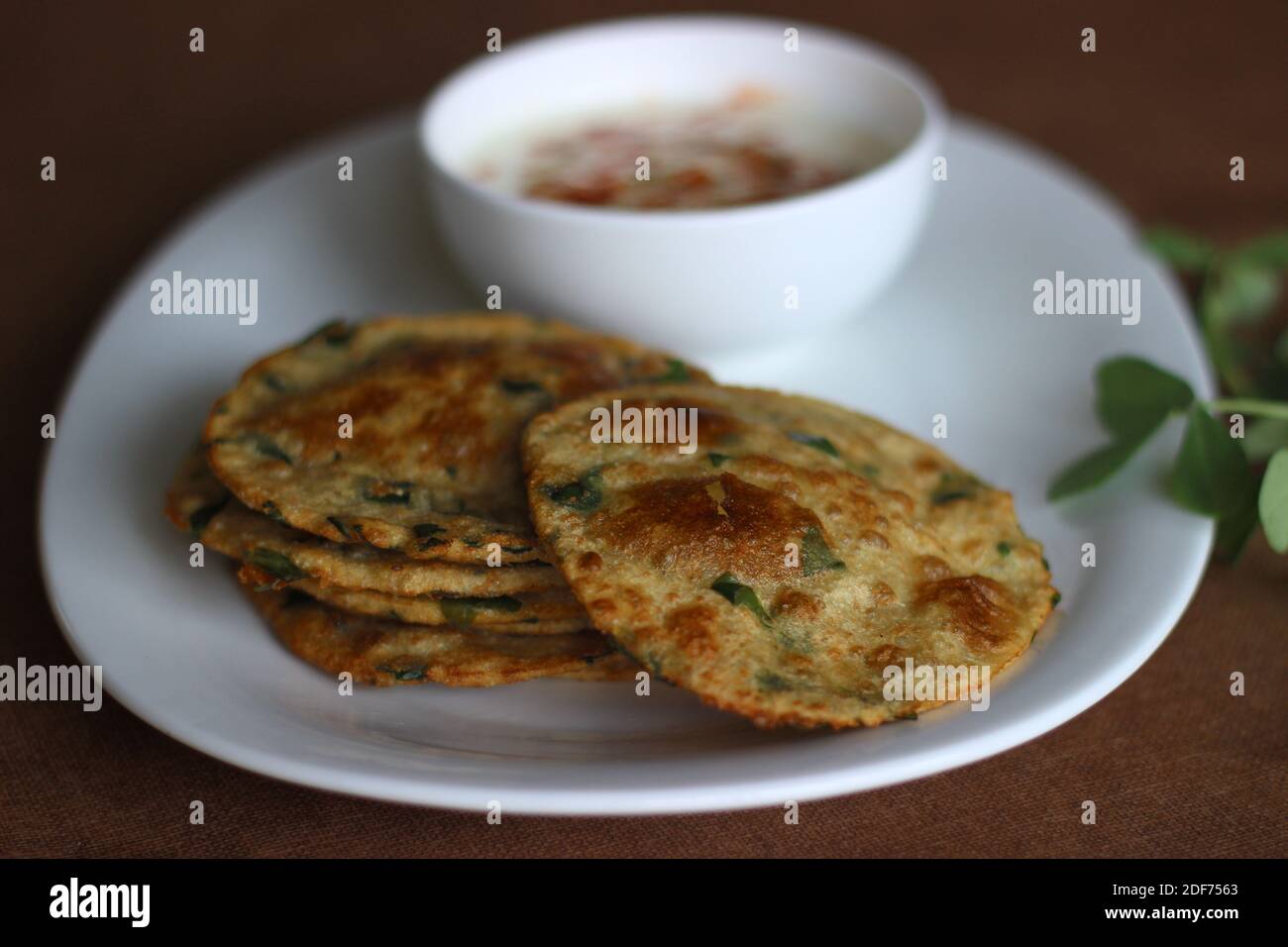 A healthy Indian flatbread called Methi poori made of whole wheat flour ...