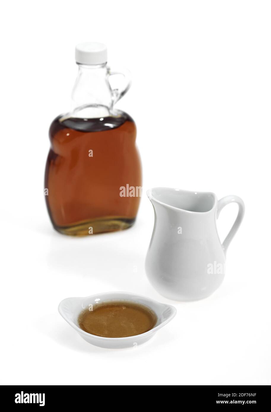 Bottle of Maple Syrup against White Background Stock Photo - Alamy