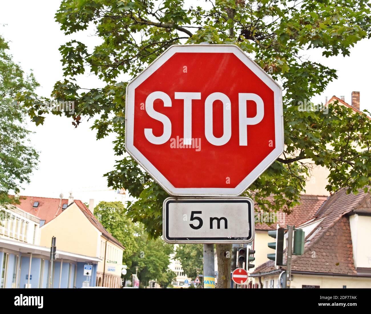 Traffic sign with a big red stop inside of an octagon Stock Photo - Alamy