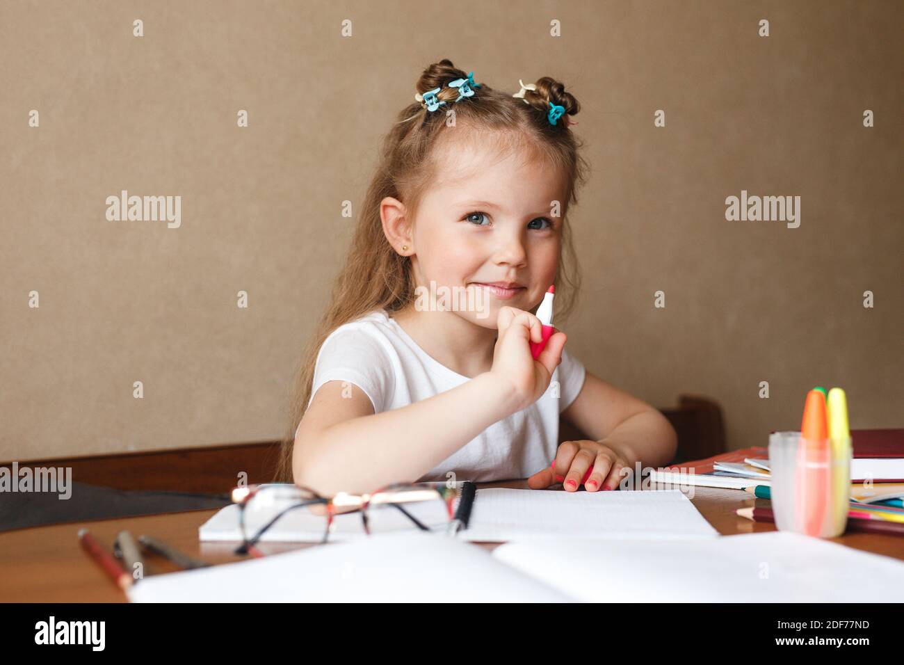 Child doing homework writing and reading at home Stock Photo - Alamy