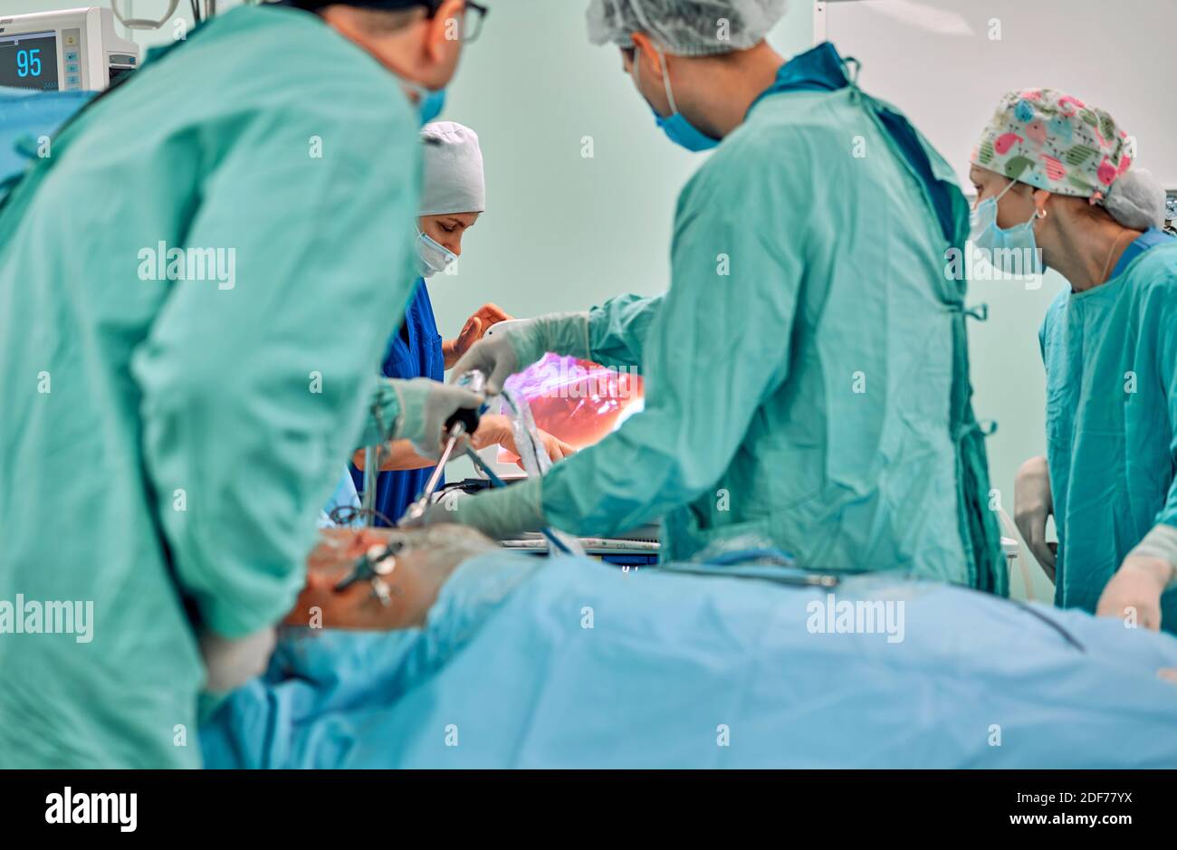 Surgeon Inserting Tube Into Patient During Surgery Stock Photo - Alamy