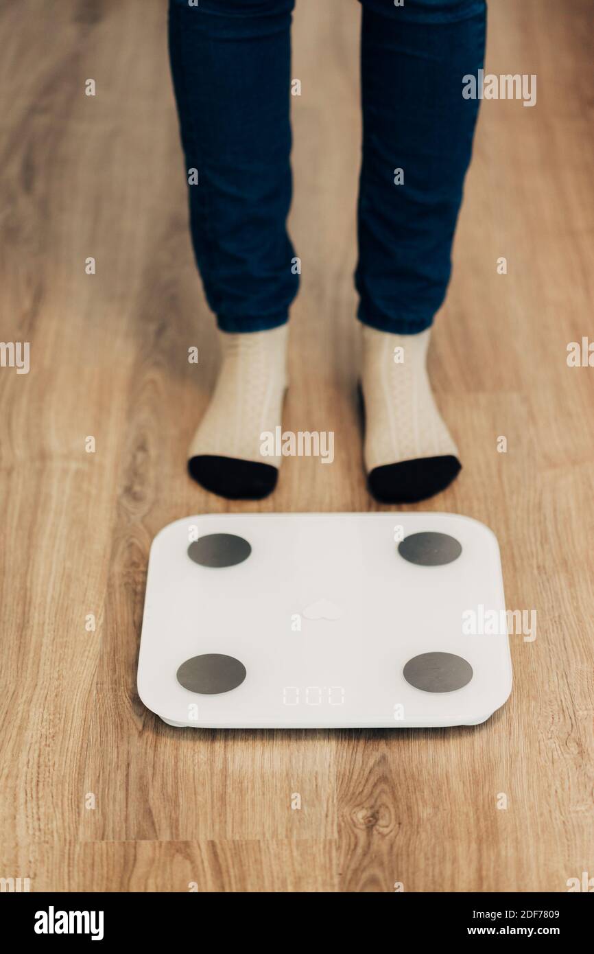 Modern Electronic Device. Girl Measures Weight on Smart Scales Stock ...