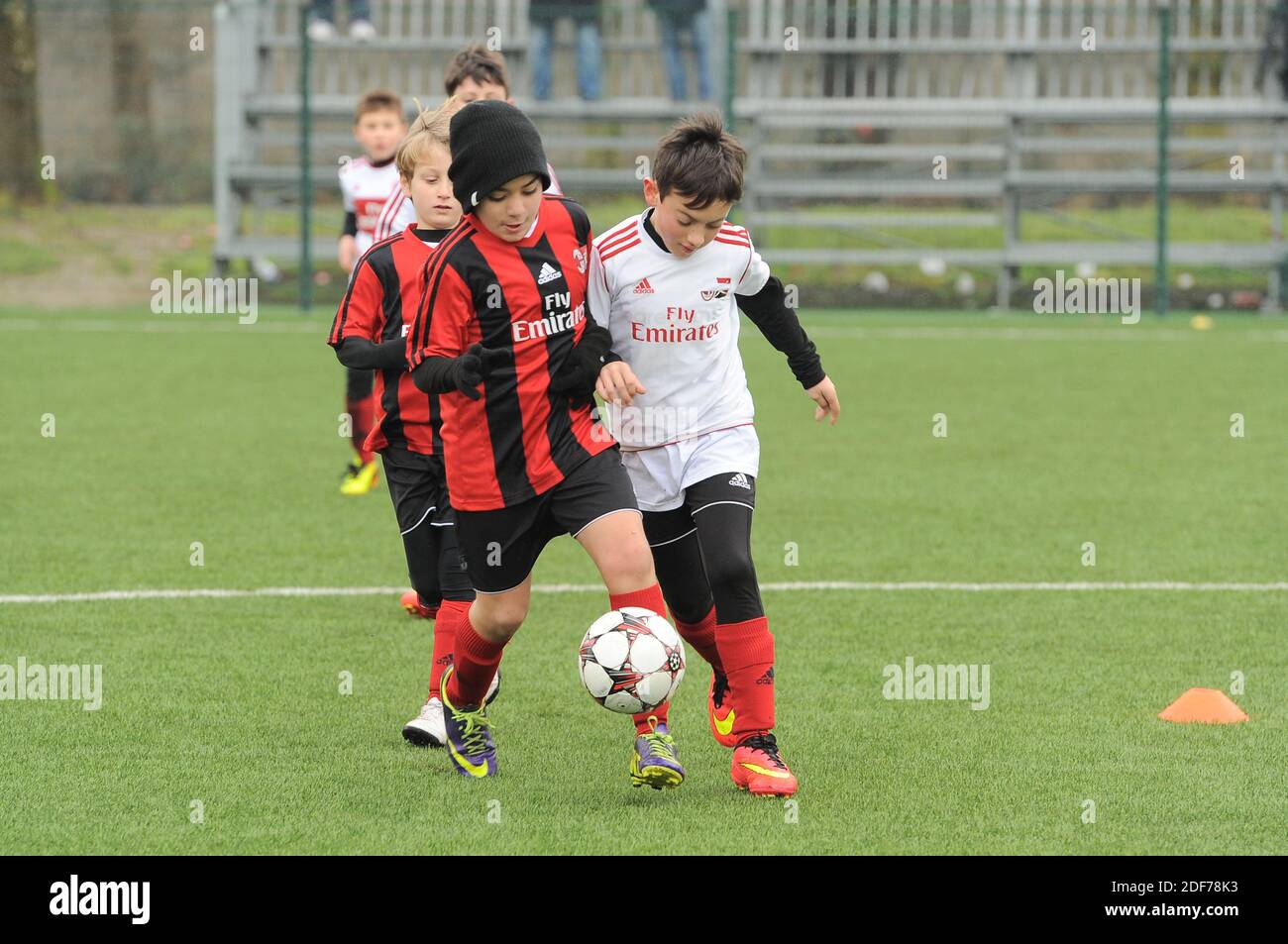 Kids' soccer, children play ball in football school Stock Photo - Alamy