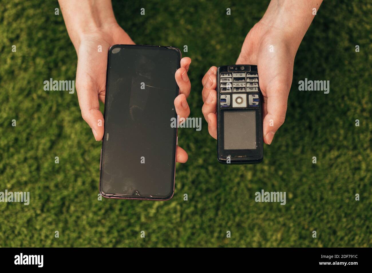 The Human Hand Choosing Phone That Lies Near New Smartphones Stock ...