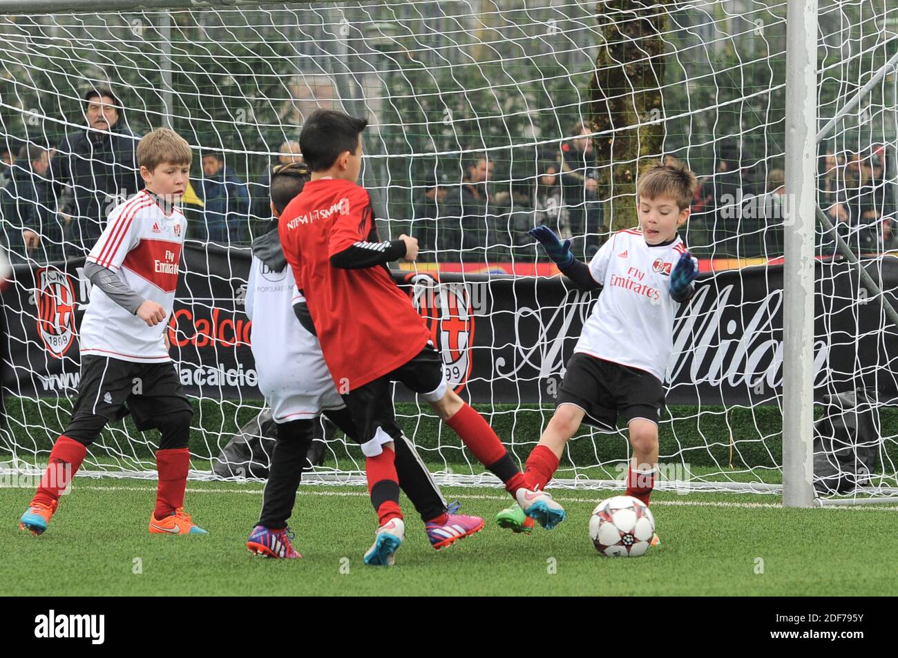 Kids' soccer, children play ball in football school Stock Photo - Alamy