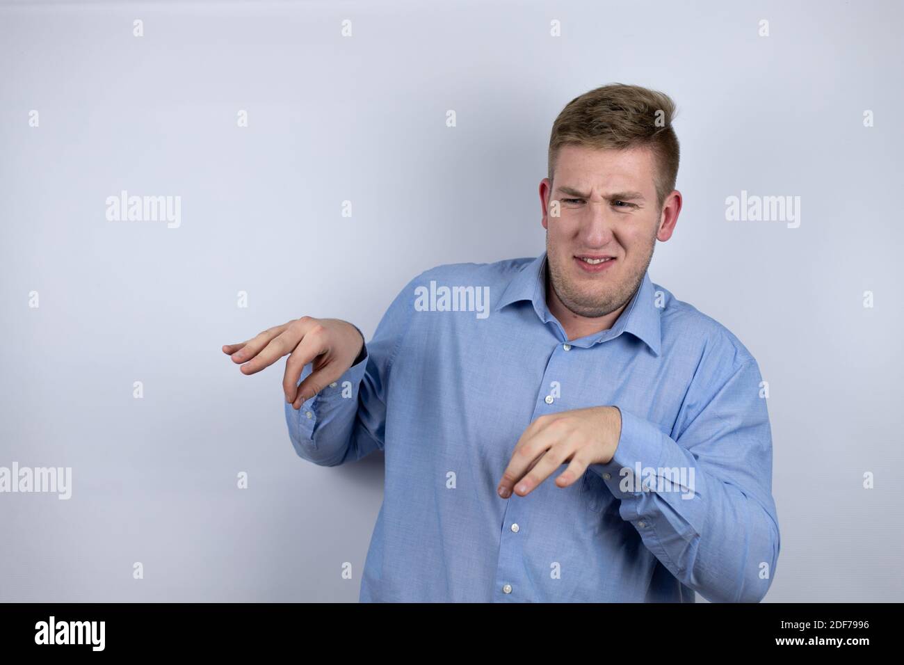 Business young man wearing a casual shirt over white background ...